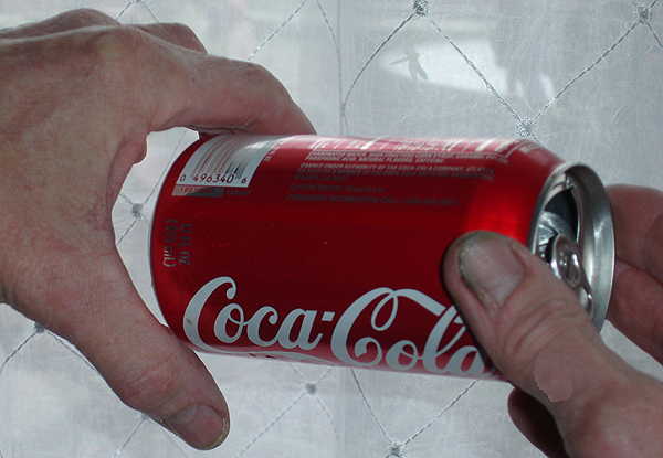 Grasp and hold firmly (but gently) the Can at it's Base (bottom of Can).